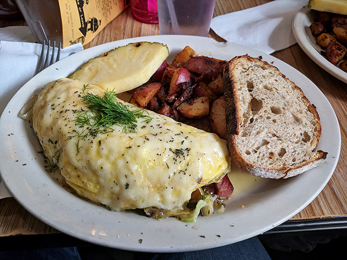 Not your average omelet. This cheese-blanketed beauty comes with homefries that have clearly been introduced to seasoning and aren't afraid to show it.