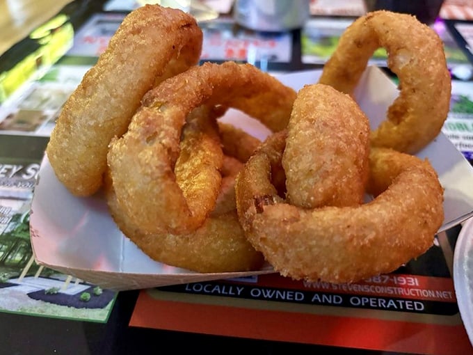 Golden halos of crispy perfection. These onion rings aren't just a side dish&mdash;they're the supporting actors who steal the scene.