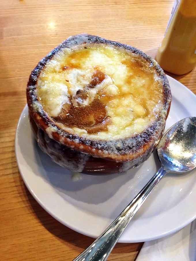 Behold the legendary French onion soup &ndash; that cheese pull could win Olympic medals, while the broth beneath deserves its own hall of fame.