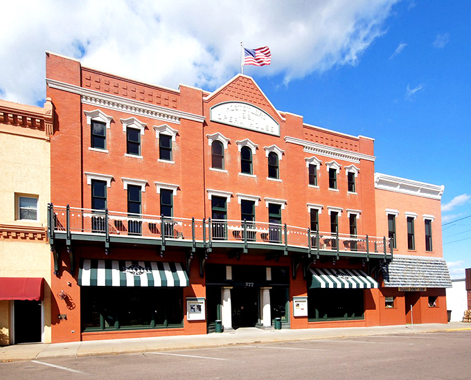 The Opera House stands as Minden's architectural diva, flaunting her coral-hued facade and ornate details like she knows she's the belle of the downtown ball. 