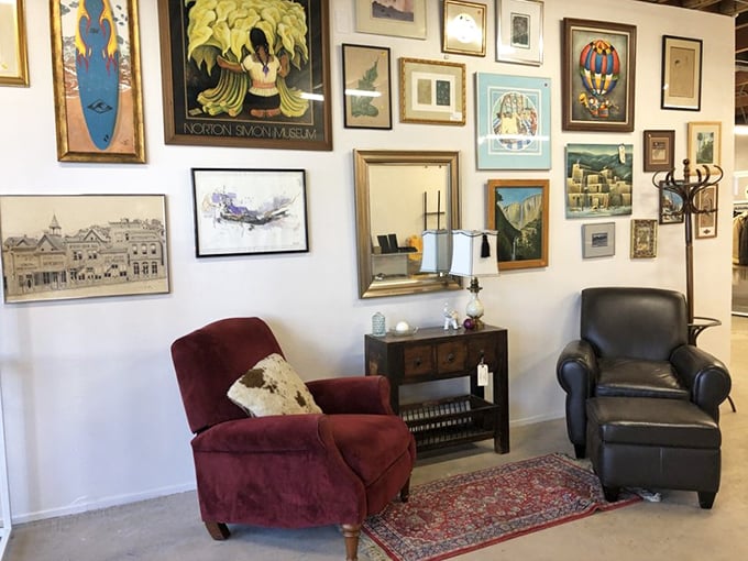 The wall of art creates a gallery effect that would make museum curators jealous. That burgundy recliner has stories to tell.