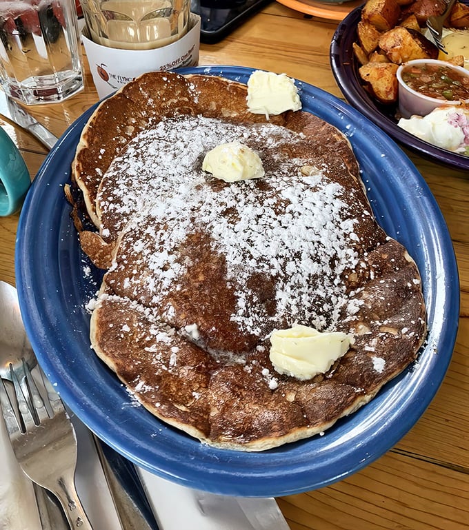 Pancakes so perfectly golden they deserve their own Olympic medal. Those butter pats are melting almost as fast as my willpower.
