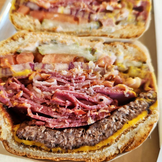 Behold the legendary pastrami burger in all its glory! Meat-on-meat architecture that would make Frank Gehry weep with joy.