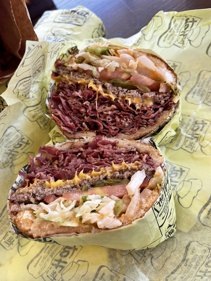 Behold the engineering marvel that makes you question every burger decision you've ever made before this moment.