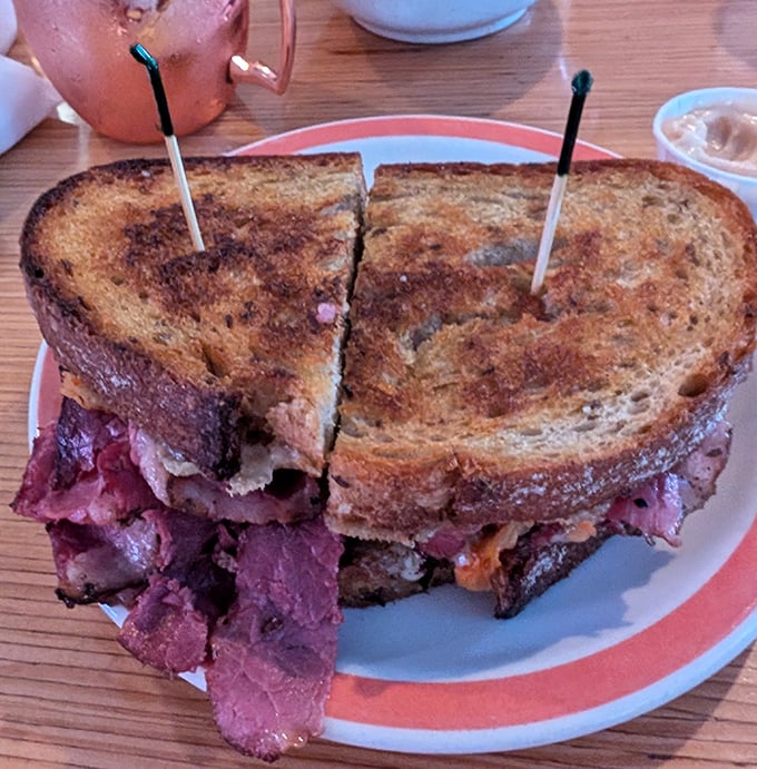 The legendary Pastrami Reuben in all its glory. Thick-cut meat, perfectly toasted rye, and that secret sauce—this sandwich doesn't need a passport to transport you.
