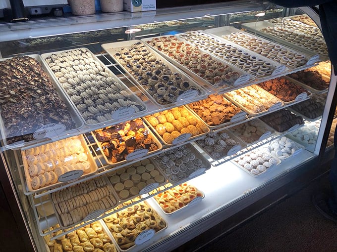 Cookie heaven exists, and it's behind this glass. Each tray represents decades of Italian baking tradition and approximately 10,000 calories of joy.