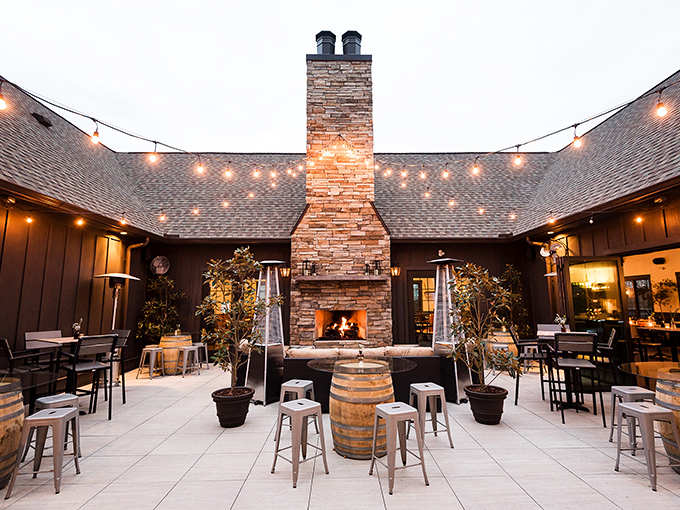 This outdoor fireplace patio isn't just gorgeous&mdash;it's where memories are made, one toast at a time.
