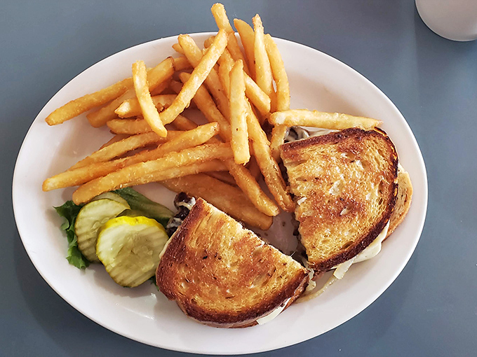 The patty melt&mdash;golden, crispy, and melty in all the right places. This isn't food photography; it's a love letter to simplicity.