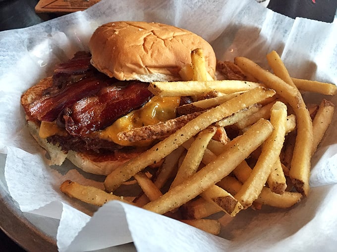 Behold the peanut butter burger that launched a thousand skeptics into believers. Golden fries stand guard beside this bacon-topped masterpiece.