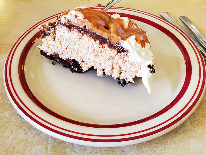 This isn't just peanut butter pie&mdash;it's therapy on a plate. Layers of chocolate, peanut butter, and whipped cream conspiring to make your diet resolutions disappear.