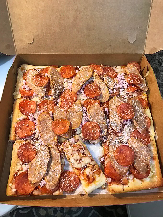 This isn't just pepperoni and sausage pizza&mdash;it's a masterclass in the art of proper topping distribution and cheese-to-sauce ratio engineering.