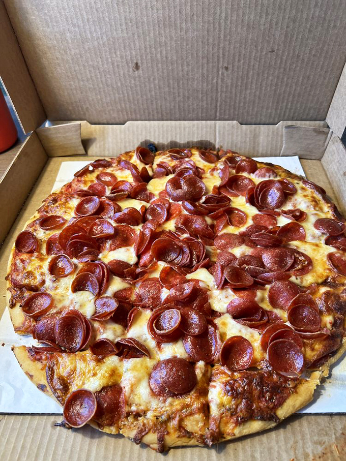 Pepperoni that curls into perfect little flavor cups, collecting precious oils like tiny edible chalices. This isn't just pizza&mdash;it's a masterclass in proper pepperoni application.