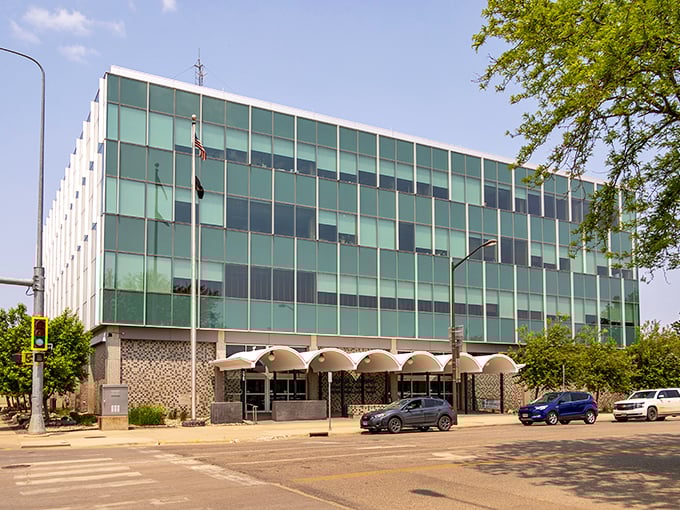 Pierre's Federal Building gleams in the prairie sun, its glass fa&ccedil;ade reflecting big sky country dreams.