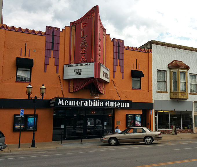 The Plaza Cinema's vibrant orange facade and vintage marquee promise entertainment without big-city prices&mdash;a perfect night out when your retirement budget still allows for popcorn.