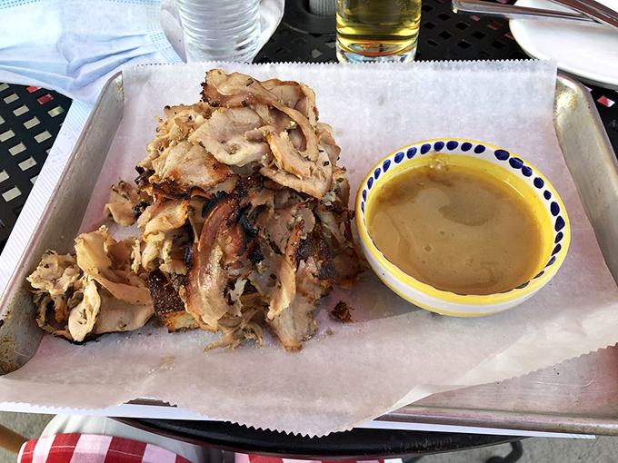 Porchetta perfection &ndash; herb-infused pork with crackling skin that makes you want to call your cardiologist just to brag about what you're eating.