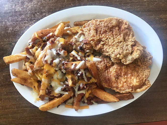 These pork chops with loaded fries aren't just a meal&mdash;they're the reason people set their GPS for Alva from three counties away.