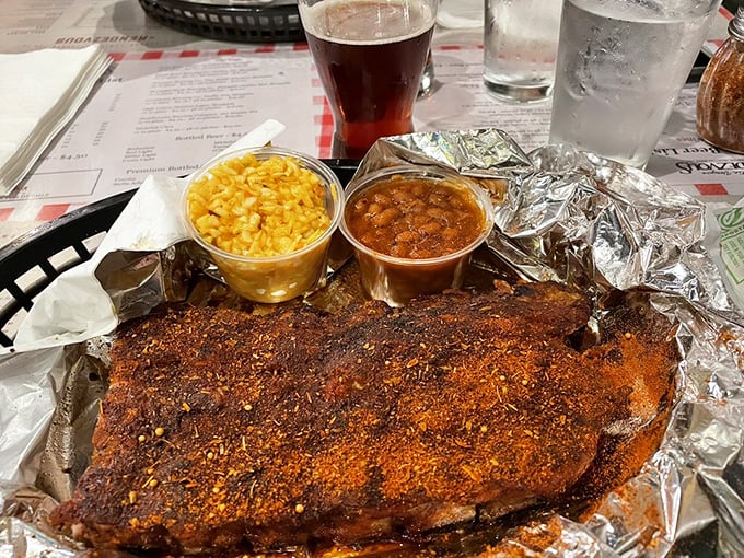 Behold the star of the show: dry-rubbed ribs in all their spice-crusted glory. That reddish coating contains secrets that have kept diners returning for decades.