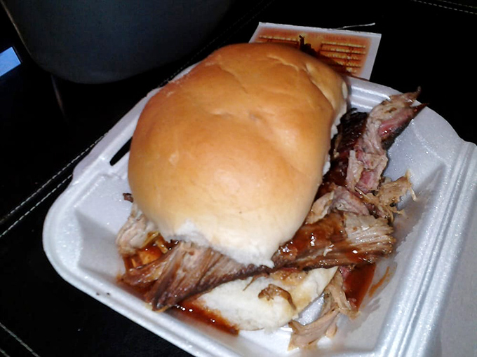 The pulled pork sandwich doesn't just satisfy hunger&mdash;it resolves existential crises. That soft bun barely containing a mountain of smoky, saucy perfection.