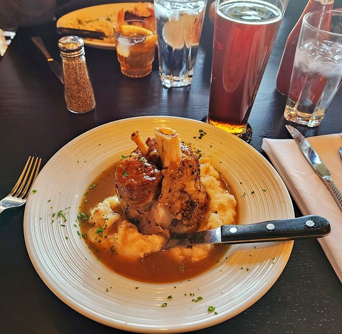 The legendary pork shank in all its glory – tender meat clinging to the bone until the last possible moment, surrounded by a sauce you'll dream about later.