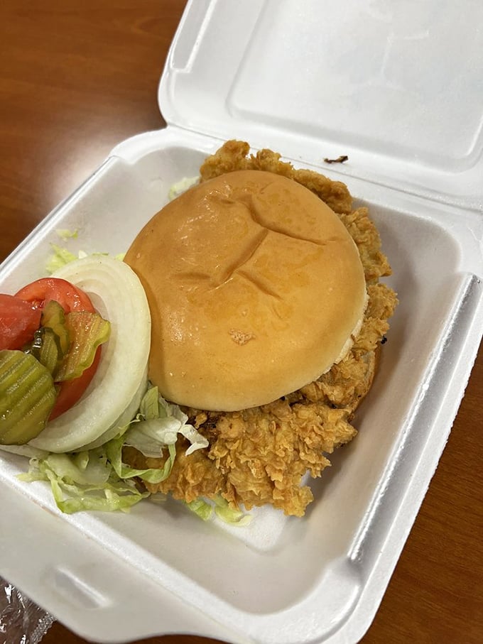 The legendary pork tenderloin sandwich&mdash;where the meat stages a rebellion against the laws of bun physics.