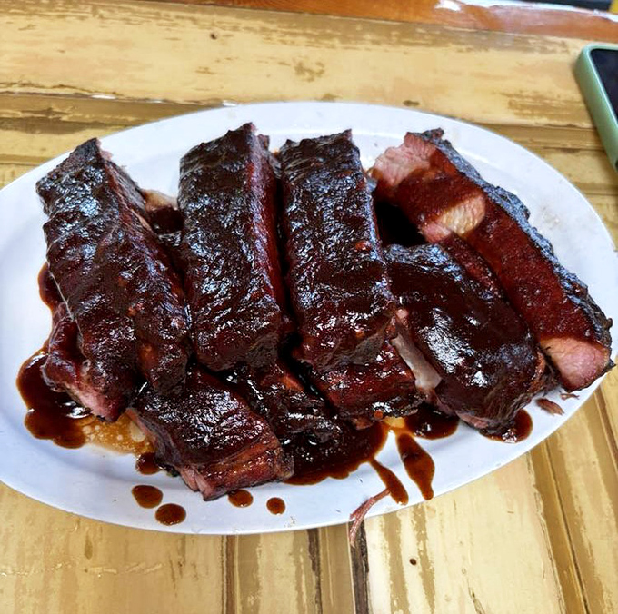 These aren't just ribs; they're edible evidence that patience is indeed a virtue. The sauce-lacquered bark whispers sweet, smoky nothings.