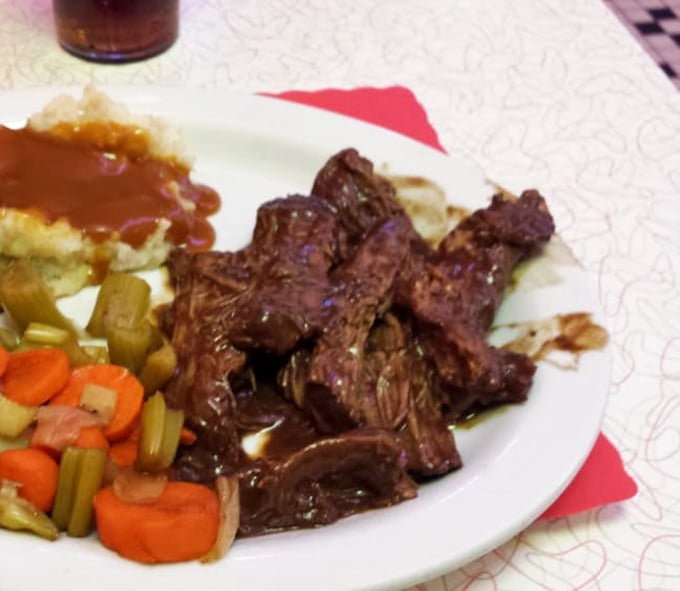 Pot roast that doesn't just fall apart—it practically surrenders. Those vegetables aren't sidekicks; they're supporting actors in a delicious drama.