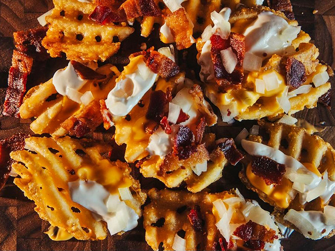 Potato skin fries&mdash;the dish that makes you question why you've wasted years eating regular fries. Cheese, bacon, and sour cream transform waffle fries into edible art.