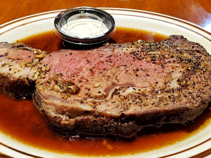 This prime rib isn't just dinner; it's a religious experience. The seasoned crust gives way to meat so tender it practically surrenders.