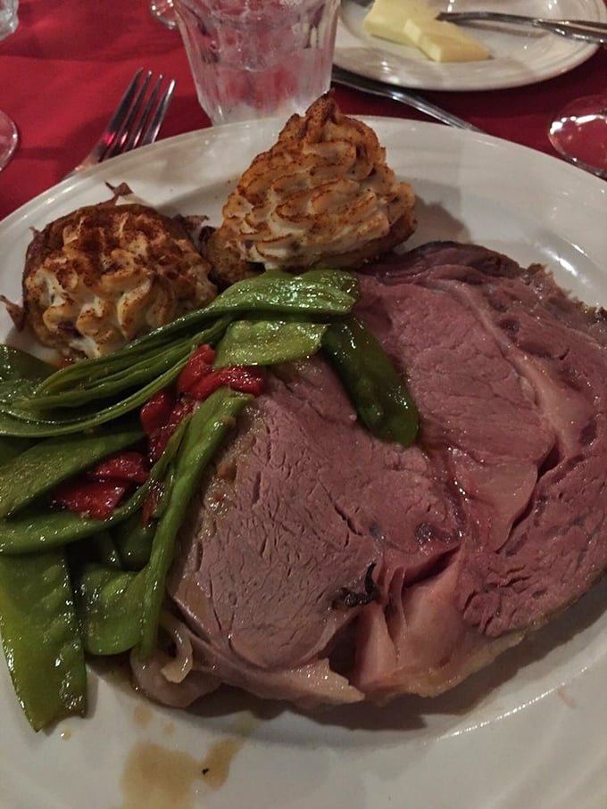 The prime rib arrives like a carnivore's dream &ndash; perfectly pink, accompanied by snow-capped potato mountains and vibrant green beans that aren't just plate decoration.