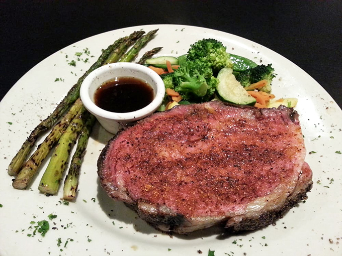 Behold the star of the show: prime rib cooked to rosy perfection, accompanied by vegetables that aren't mere afterthoughts.