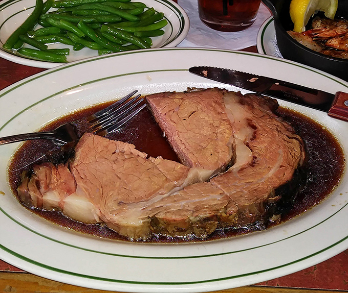 This prime rib arrives swimming in its own glory &ndash; thick, juicy, and unapologetically perfect.