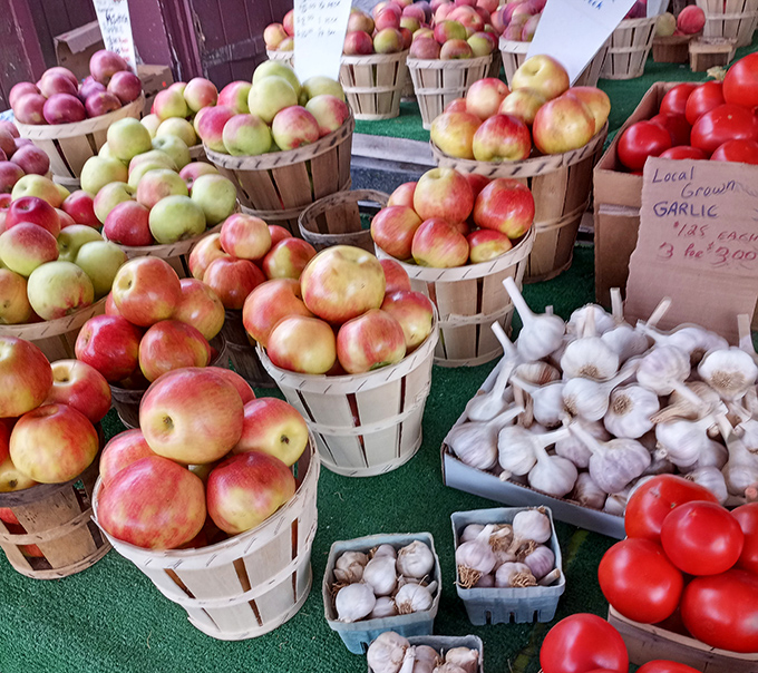 Apple heaven meets garlic paradise. These wooden bushel baskets overflow with Pennsylvania's finest produce, making grocery store offerings seem positively bland by comparison.