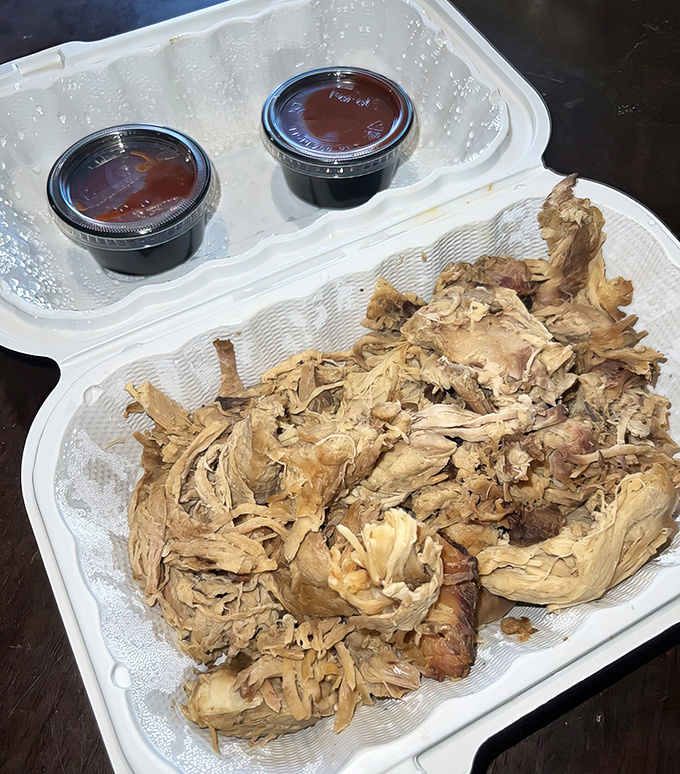 Behold the star of the show: pulled pork in its natural habitat, tender strands waiting to transport you to barbecue nirvana.