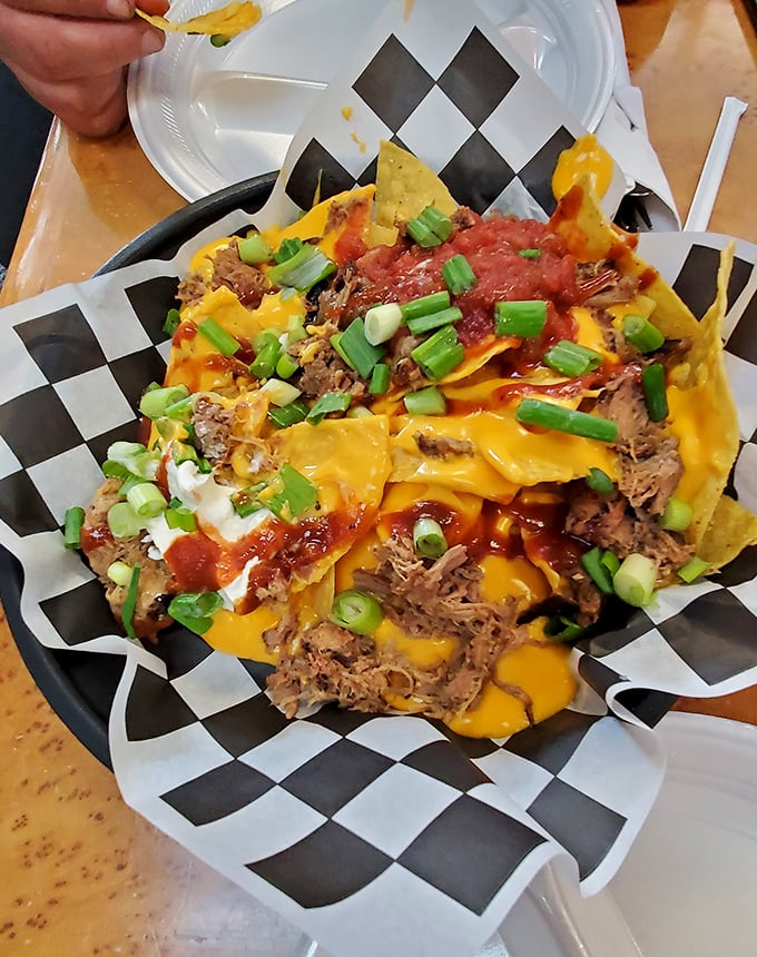 These pulled pork nachos aren't just a meal – they're an architectural achievement of meat, cheese, and green onions that would make Frank Lloyd Wright jealous.