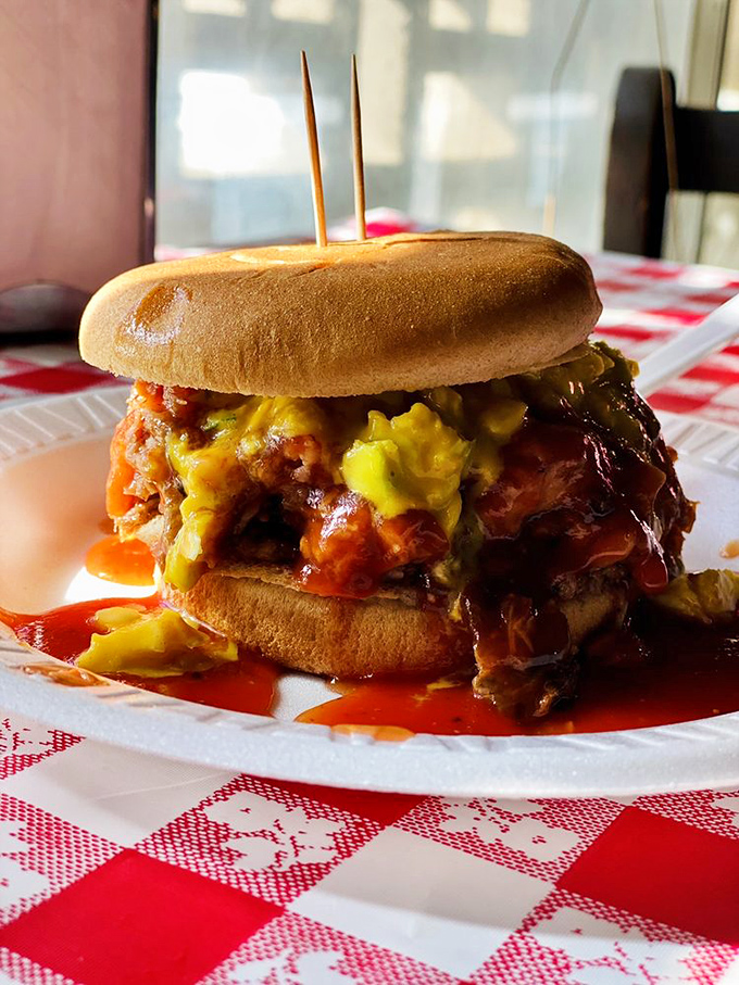 Behold the sandwich that launches pilgrimages! That golden mustard slaw cascading over smoky pork is the barbecue equivalent of a standing ovation.