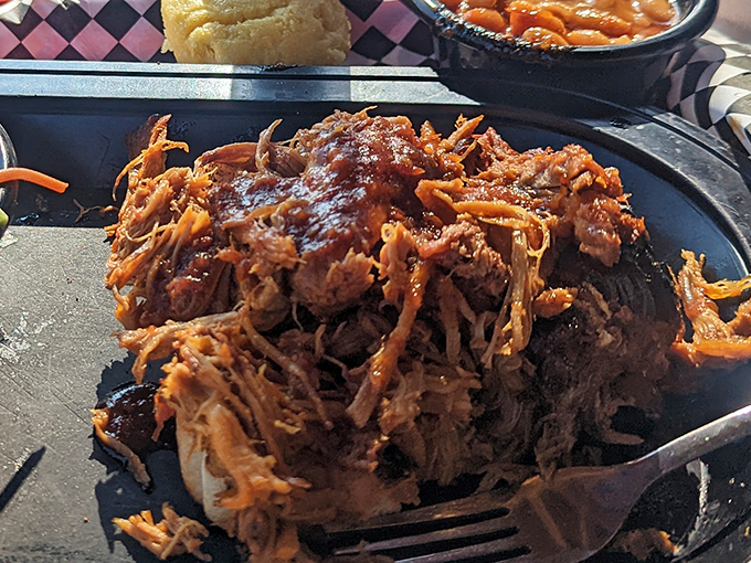 Pulled pork perfection that doesn't need fancy plating. This mountain of smoky, saucy goodness is what BBQ dreams are made of.