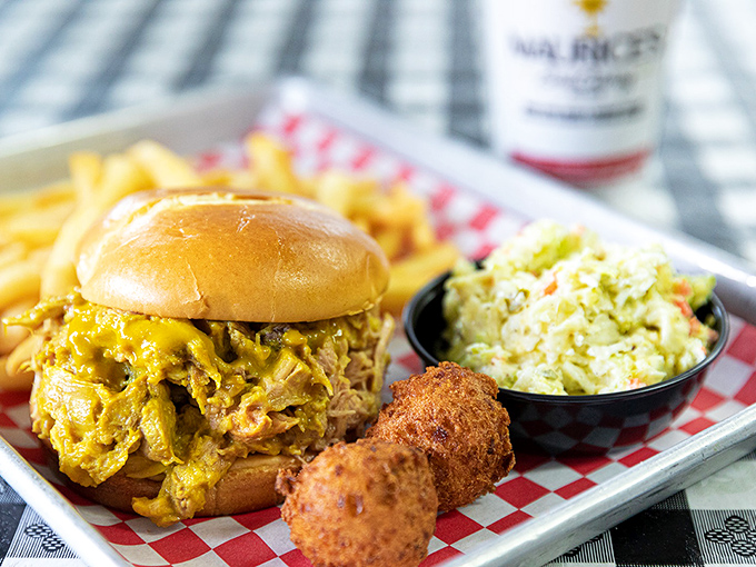 This isn't just a sandwich; it's South Carolina's culinary legacy on a bun &ndash; golden mustard sauce cascading over perfectly pulled pork like edible sunshine.