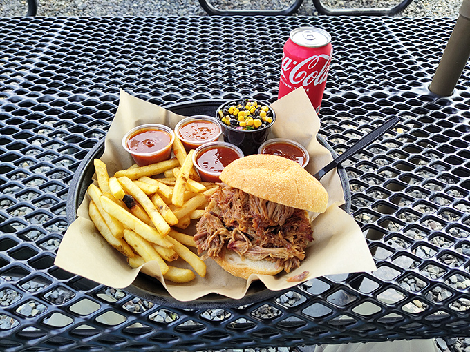 This pulled pork sandwich isn't just lunch&mdash;it's a religious experience on a kaiser roll with fries that deserve their own fan club.