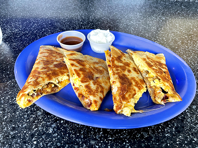 The "Dang Quesadilla" in all its glory &ndash; perfectly grilled with melty cheese and savory fillings, served with dipping sauces.