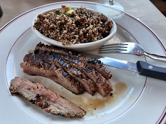 Perfectly grilled protein beside quinoa that actually tastes good&mdash;a rarity worth celebrating with proper silverware and enthusiasm.