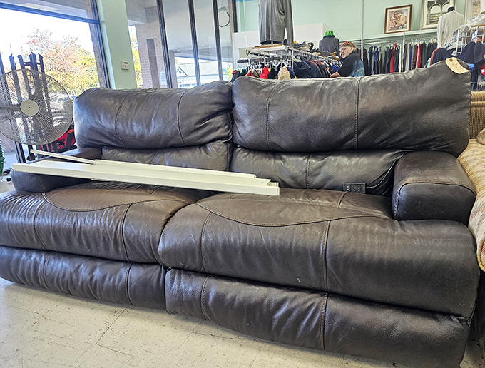 That leather sofa isn't just furniture—it's someone's future Netflix binge headquarters, waiting for its second chance at coziness.