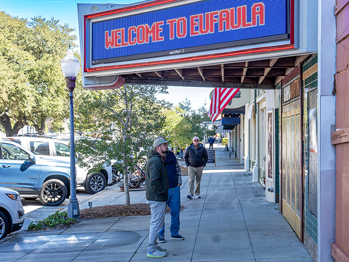 The "Welcome to Eufaula" sign greets visitors with digital Southern hospitality while historic buildings stand ready to share their stories.