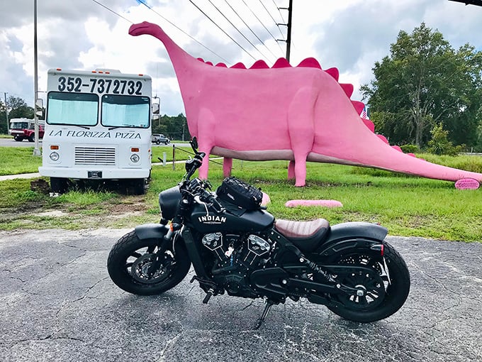 Even motorcyclists can't resist pulling over for a quick snap with this iconic landmark. Pink dinosaur meets black Indian&mdash;what a contrast!