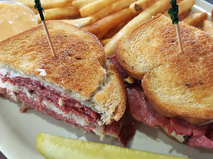 The legendary Reuben in all its glory&mdash;layers of corned beef, sauerkraut, and Swiss cheese creating the sandwich equivalent of a symphony orchestra.