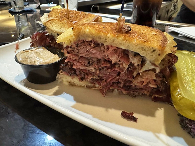 Behold the sandwich of your dreams! This towering Reuben isn't just lunch&mdash;it's an architectural marvel of corned beef, Swiss, and sauerkraut perfection.