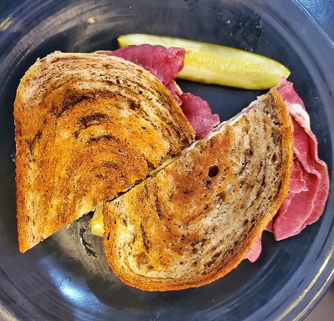 The star of the show: perfectly grilled rye bread embracing corned beef with the kind of commitment we all deserve in relationships.