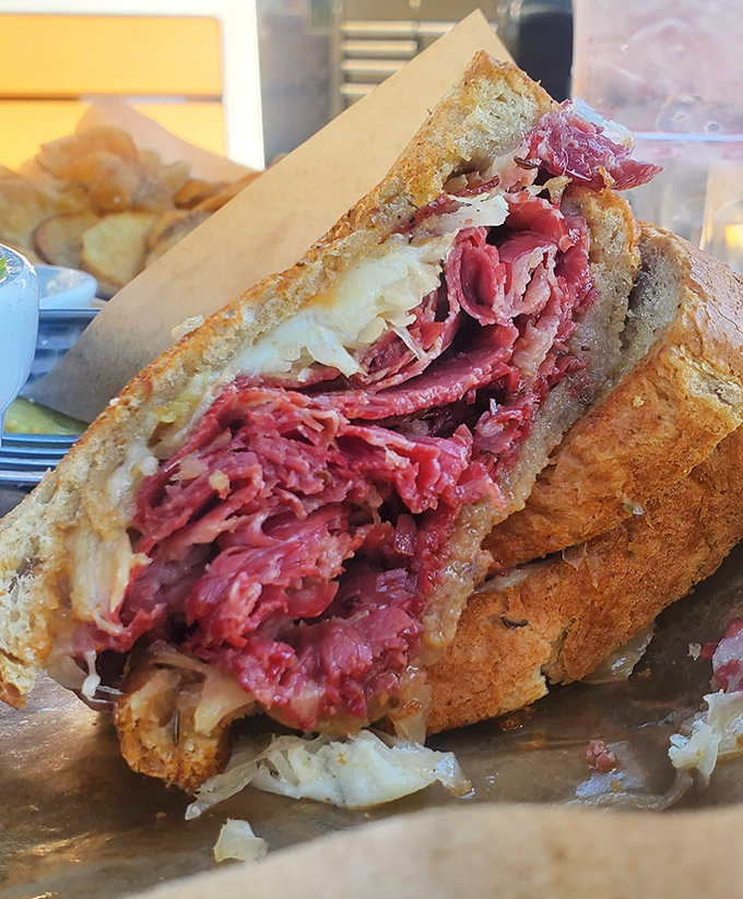 Behold the star of the show &ndash; a Reuben so perfectly stacked it could qualify as architectural achievement. That's not a sandwich, that's a monument.