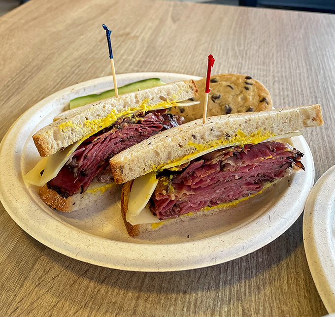 Not all heroes wear capes. Some come on rye bread with a mountain of perfectly sliced corned beef and Swiss cheese that melts into your soul.