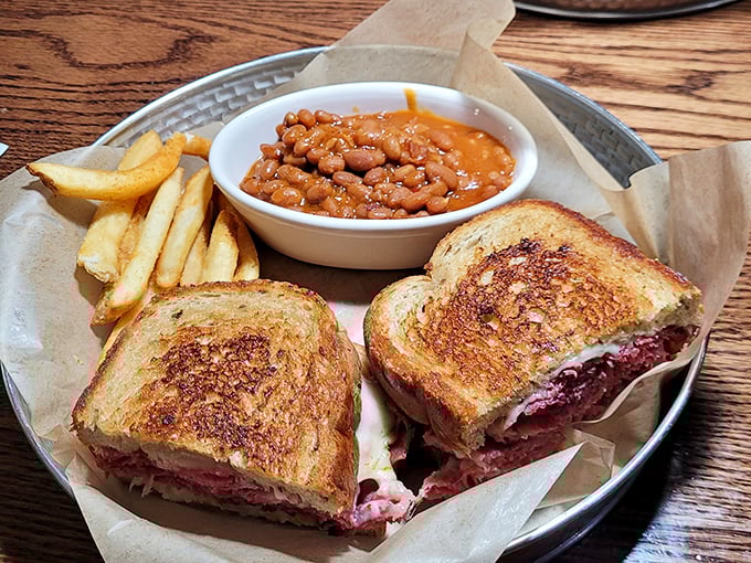 Behold the Reuben that launched a thousand road trips, perfectly grilled with corned beef piled impossibly high.