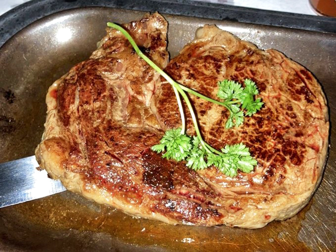 This steak isn't just cooked &ndash; it's been treated with the reverence of a religious experience. Carnivore nirvana on a sizzling platter. 